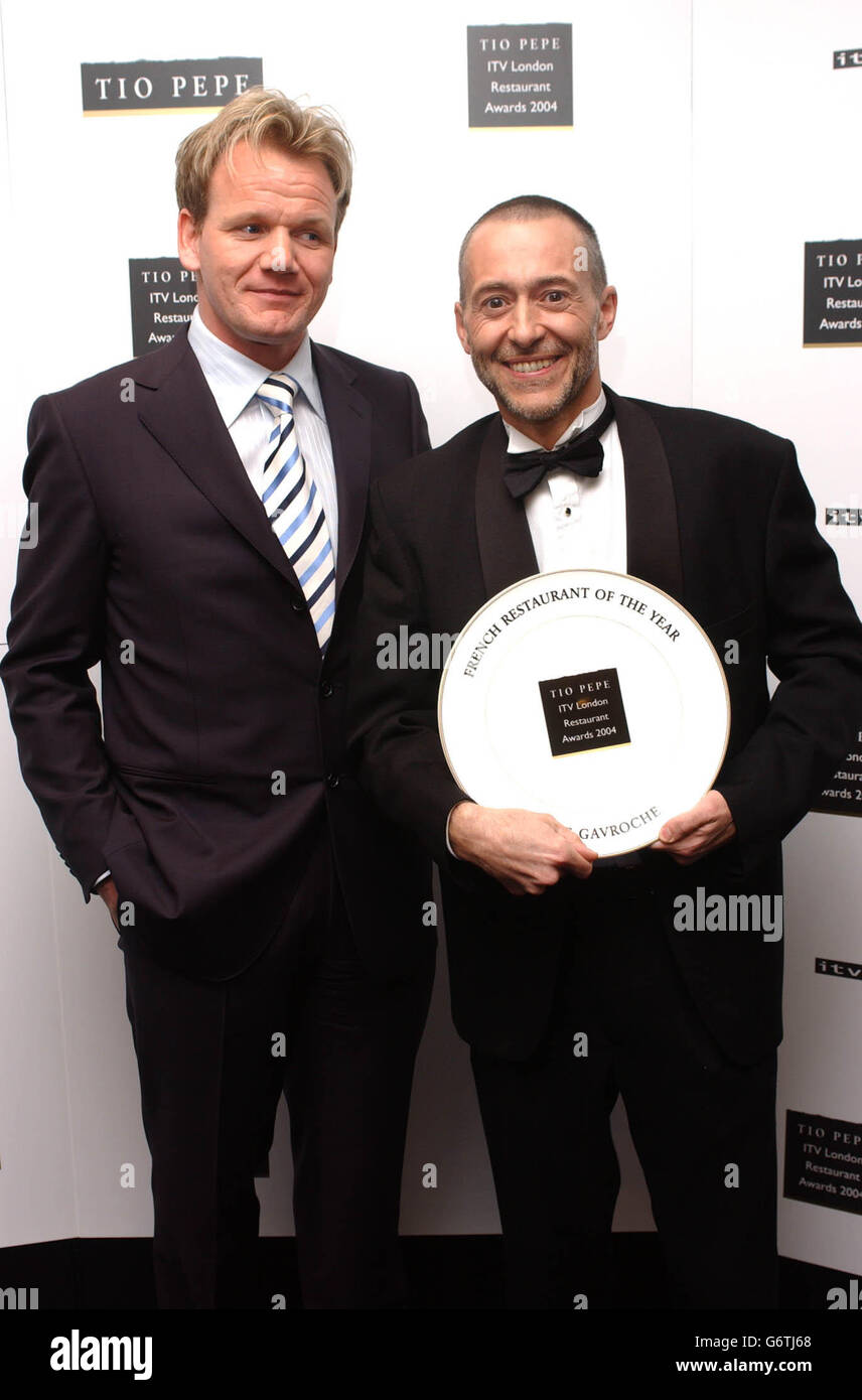 Celebrity chef Gordon Ramsay presents Michel Roux Jr with the French ...
