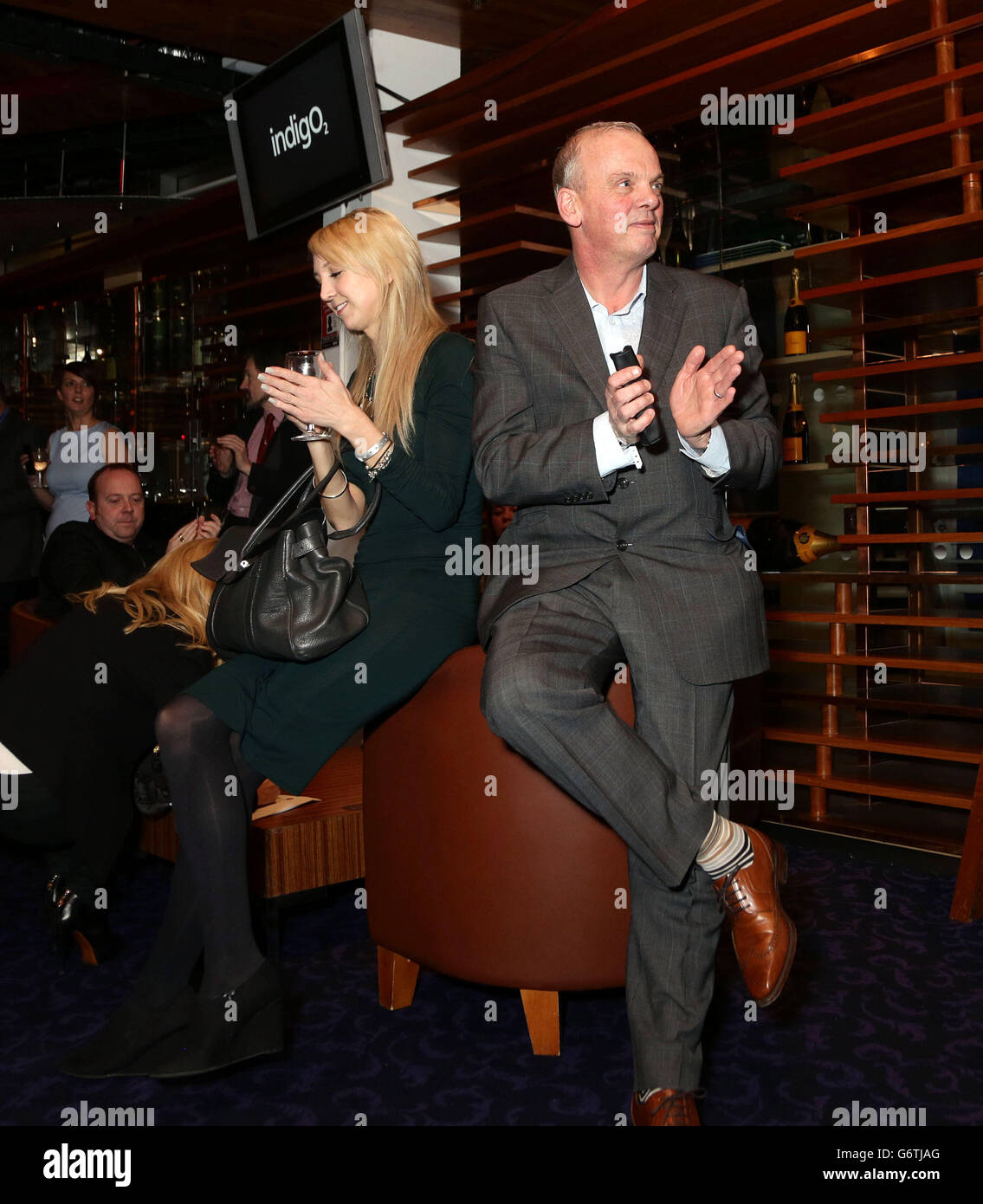 The winning bidder of a prize during the charity auction hi-res stock ...