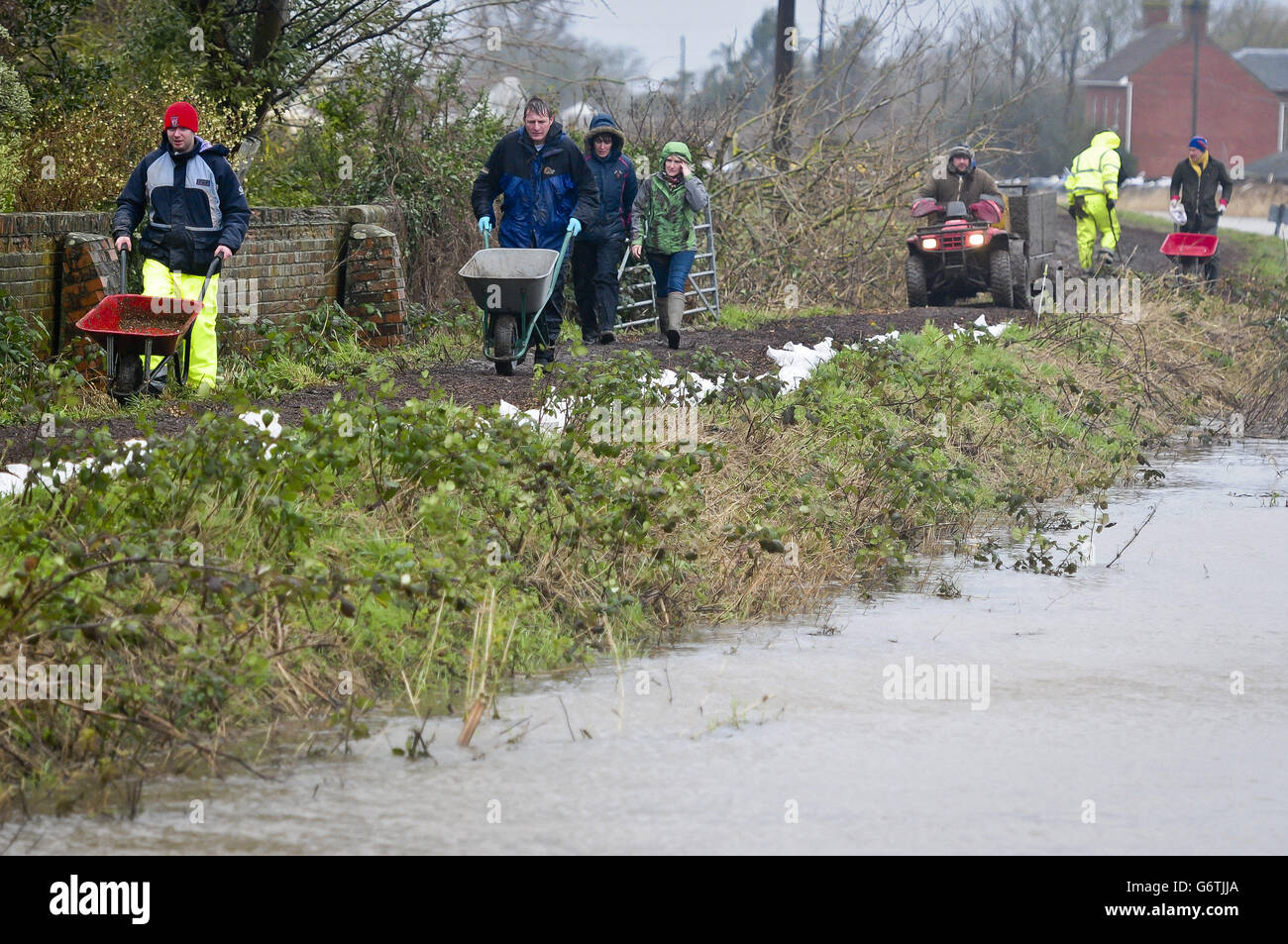 Volunteers help to create a safe access route by the River Parrett, in ...