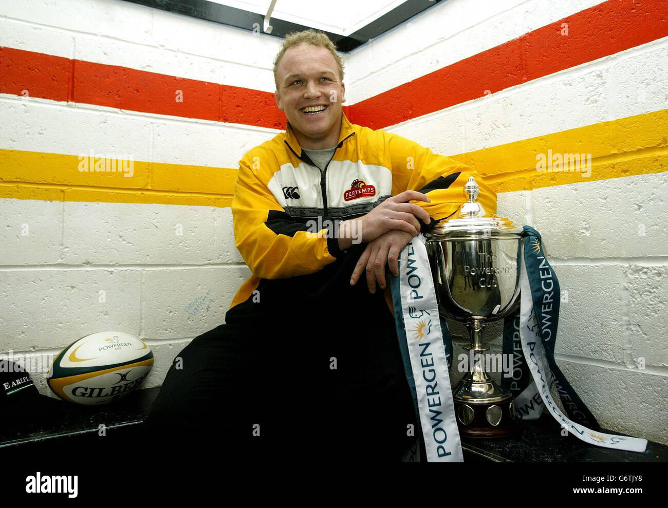 The captain of the Pertemps Bees, Ed Orgee, poses with the Powergen Cup ...
