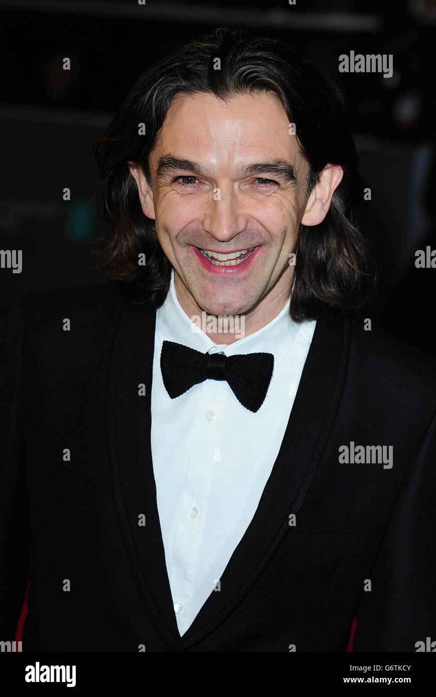 Justin chadwick arriving at the ee british academy film 2014 hi-res ...