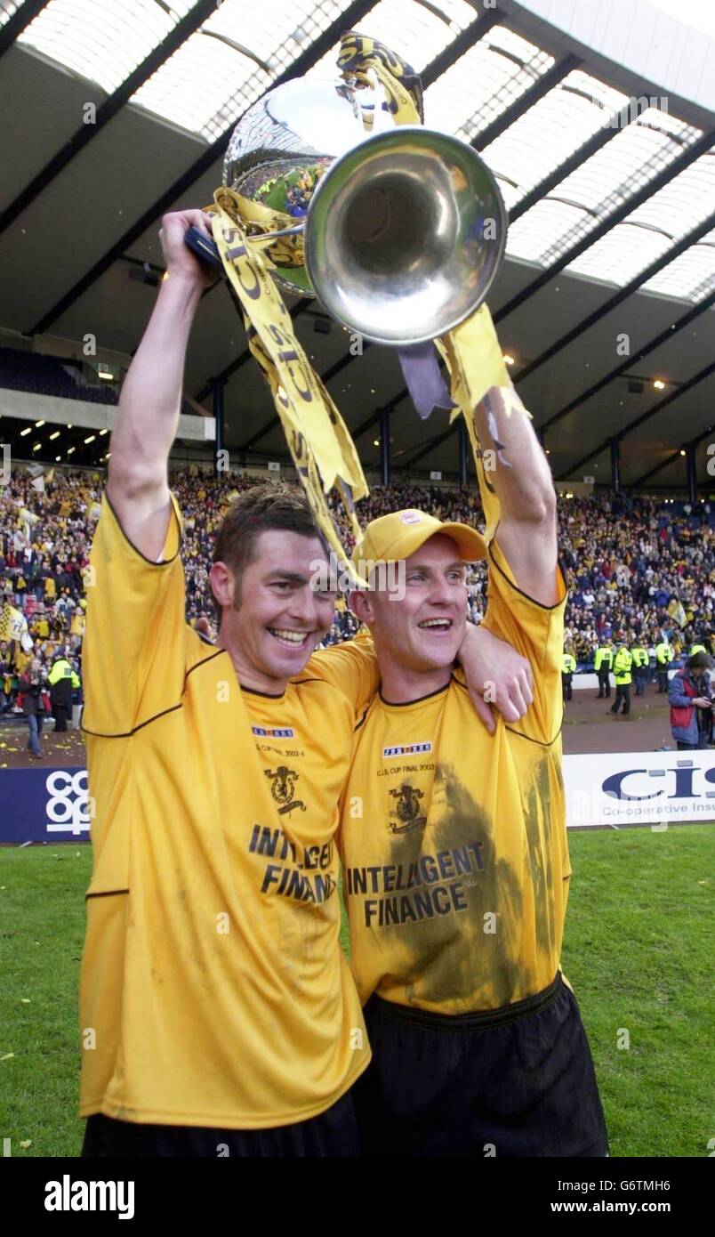 Livingston's Jamie McAllister (left) with Derek Lilley lift the CIS Cup ...