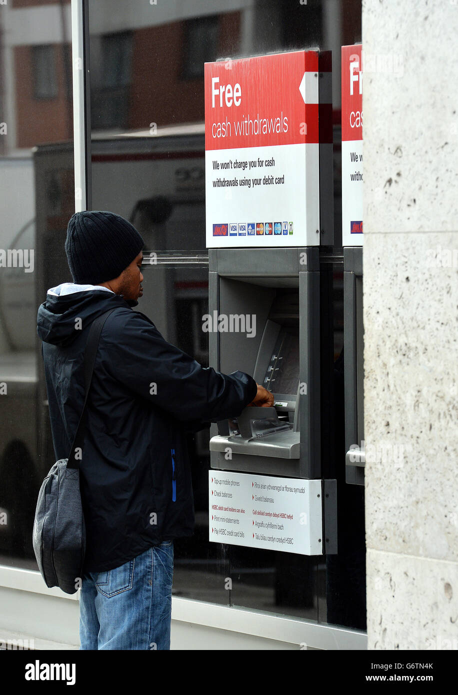 Cashpoint in use hi-res stock photography and images - Alamy