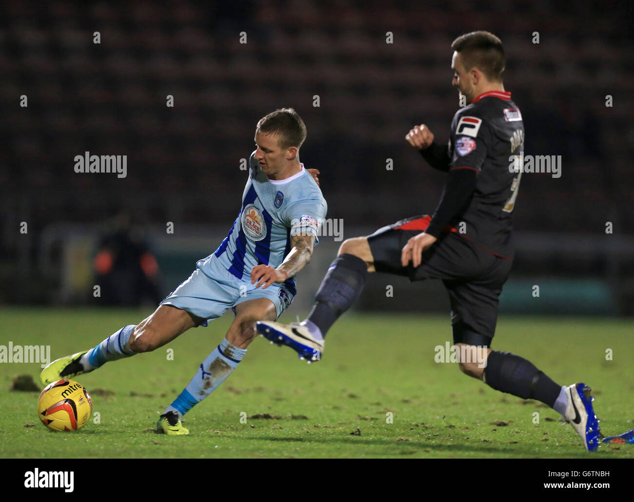 Coventry City's Carl Baker holds off a challenge from Carlisle United's ...