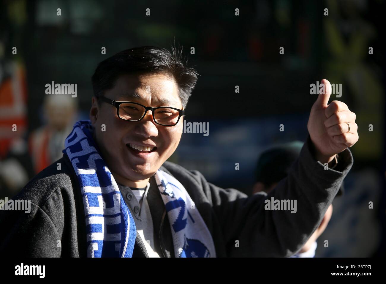 A Chelsea fan gives the thumbs up outside Stamford Bridge before the ...