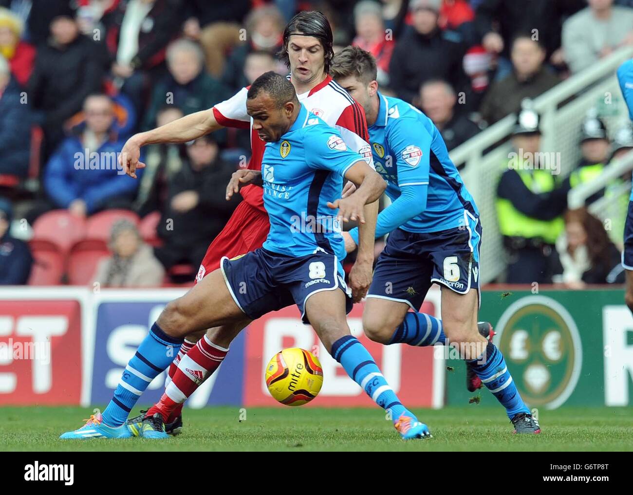 Middlesbroughs George Friend and Leeds United's Rodolph Austin and Luke ...