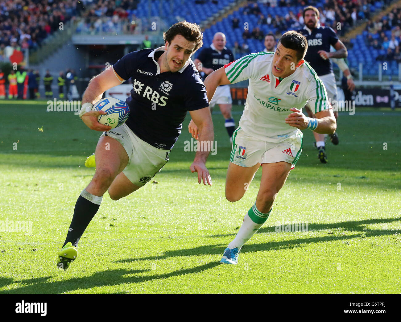 Scotland's Alex Dunbar is chased by Italy's Tommaso Allan (right) as he ...