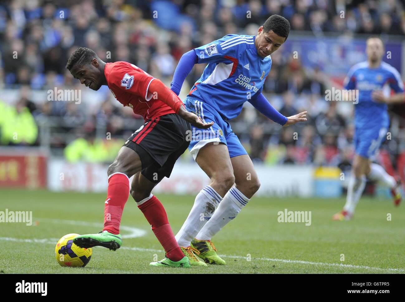 Cardiff City's Wilfried Zaha (left) and Hull City's Curtis Davies ...