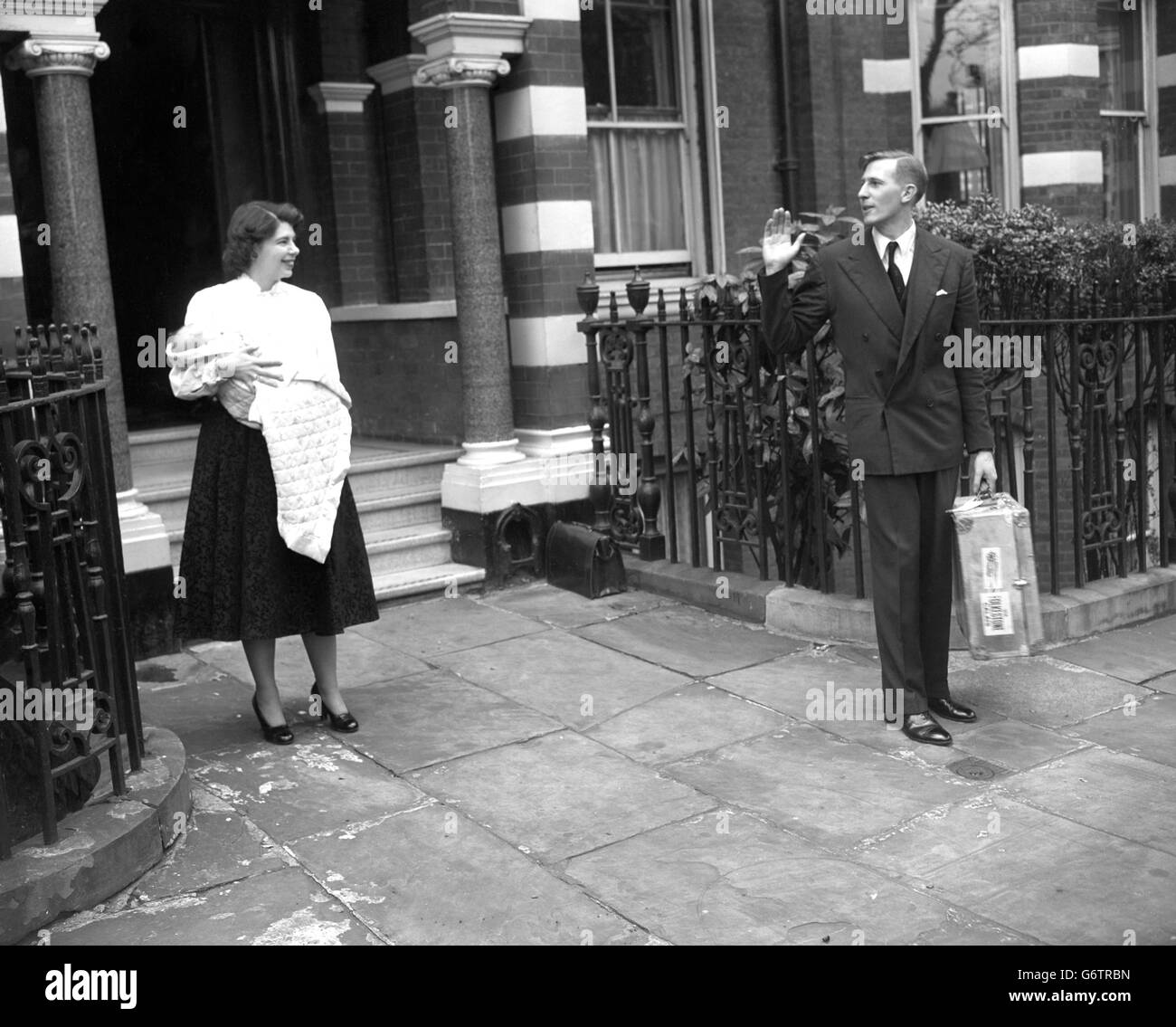 Dr Roger Bannister says goodbye to his wife and baby daughter Carole as ...