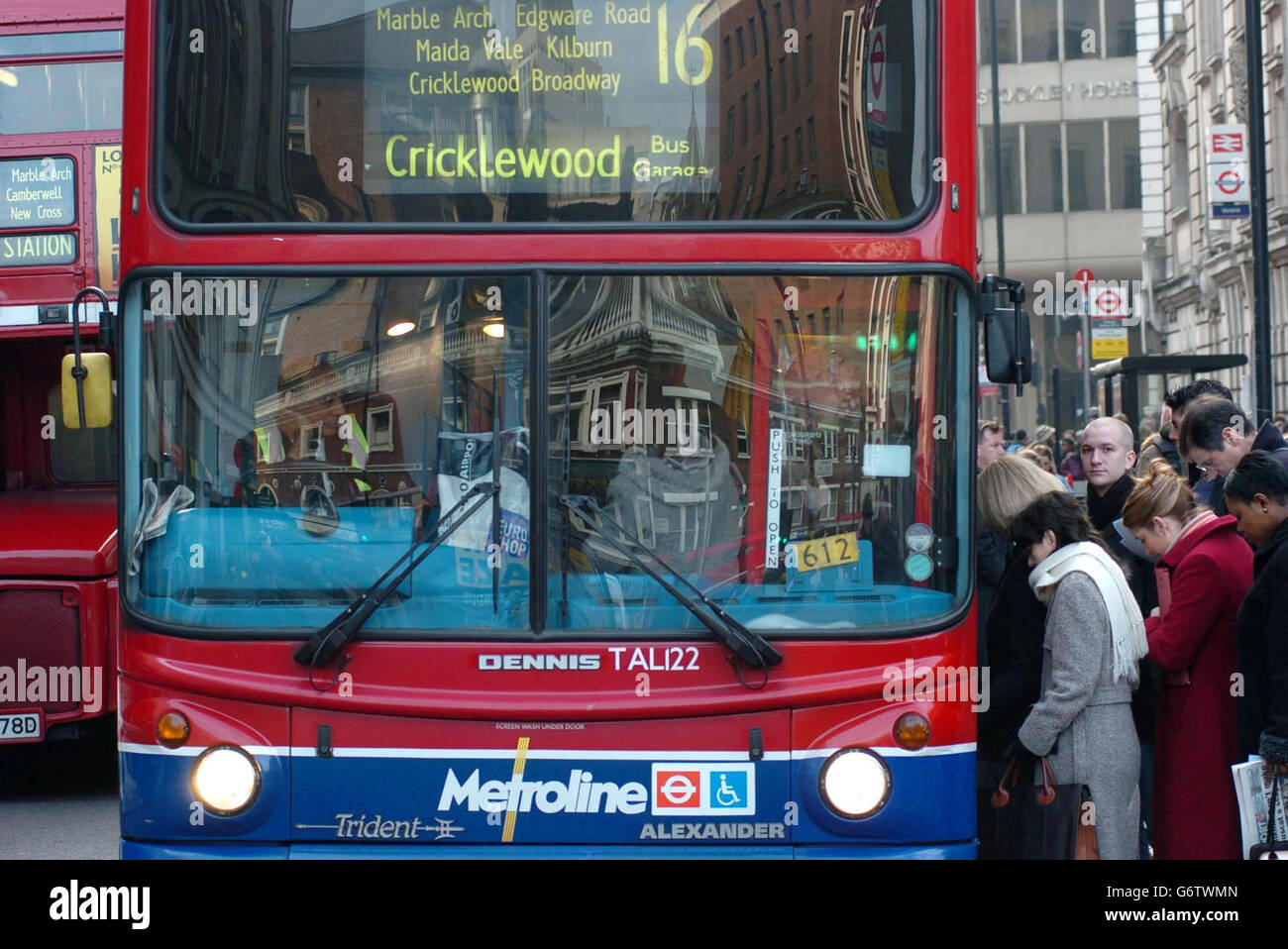 Commuters commuting transport bus red bus london bus front hi-res stock ...