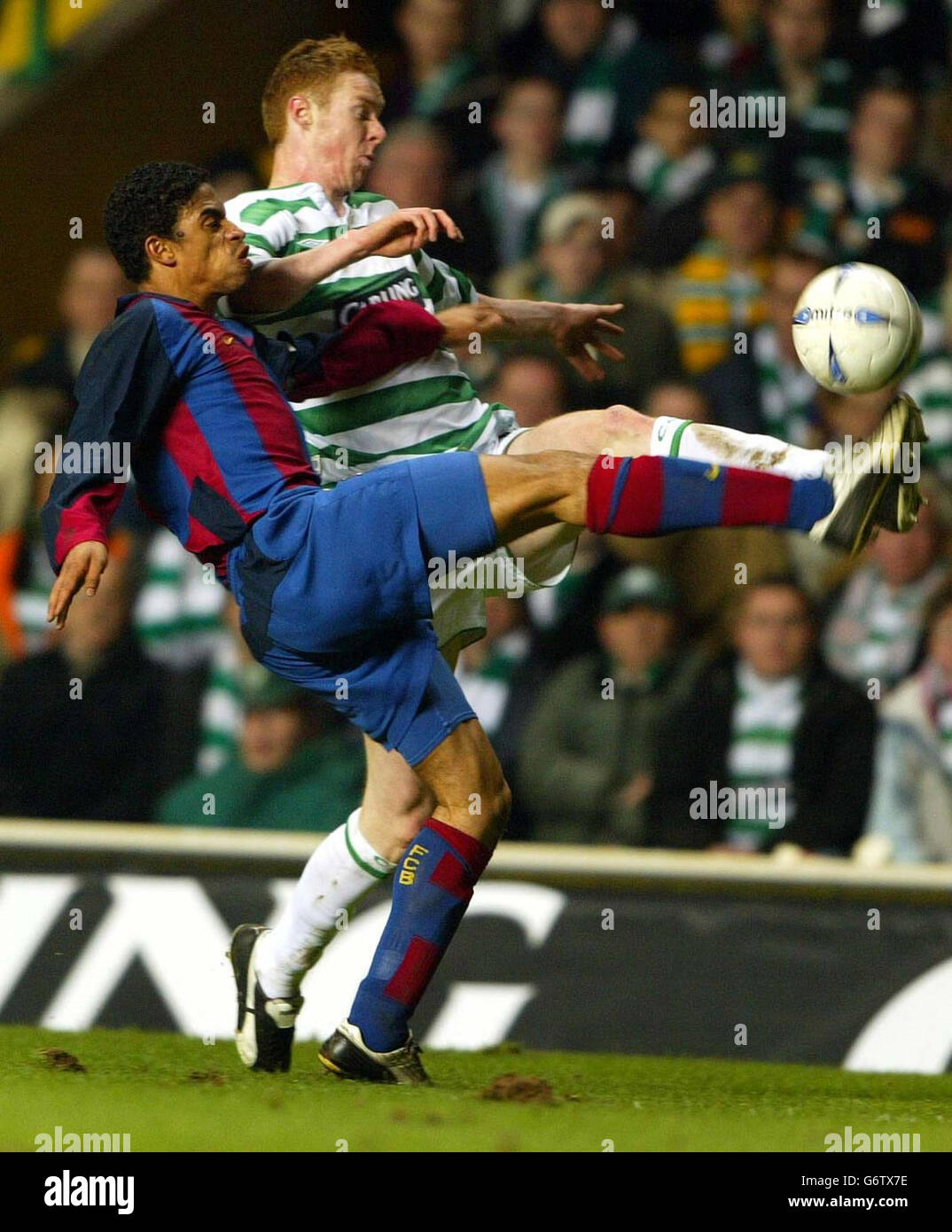 EDITORIAL USE ONLY: Celtic's Stephen Pearson (right) battles it out ...