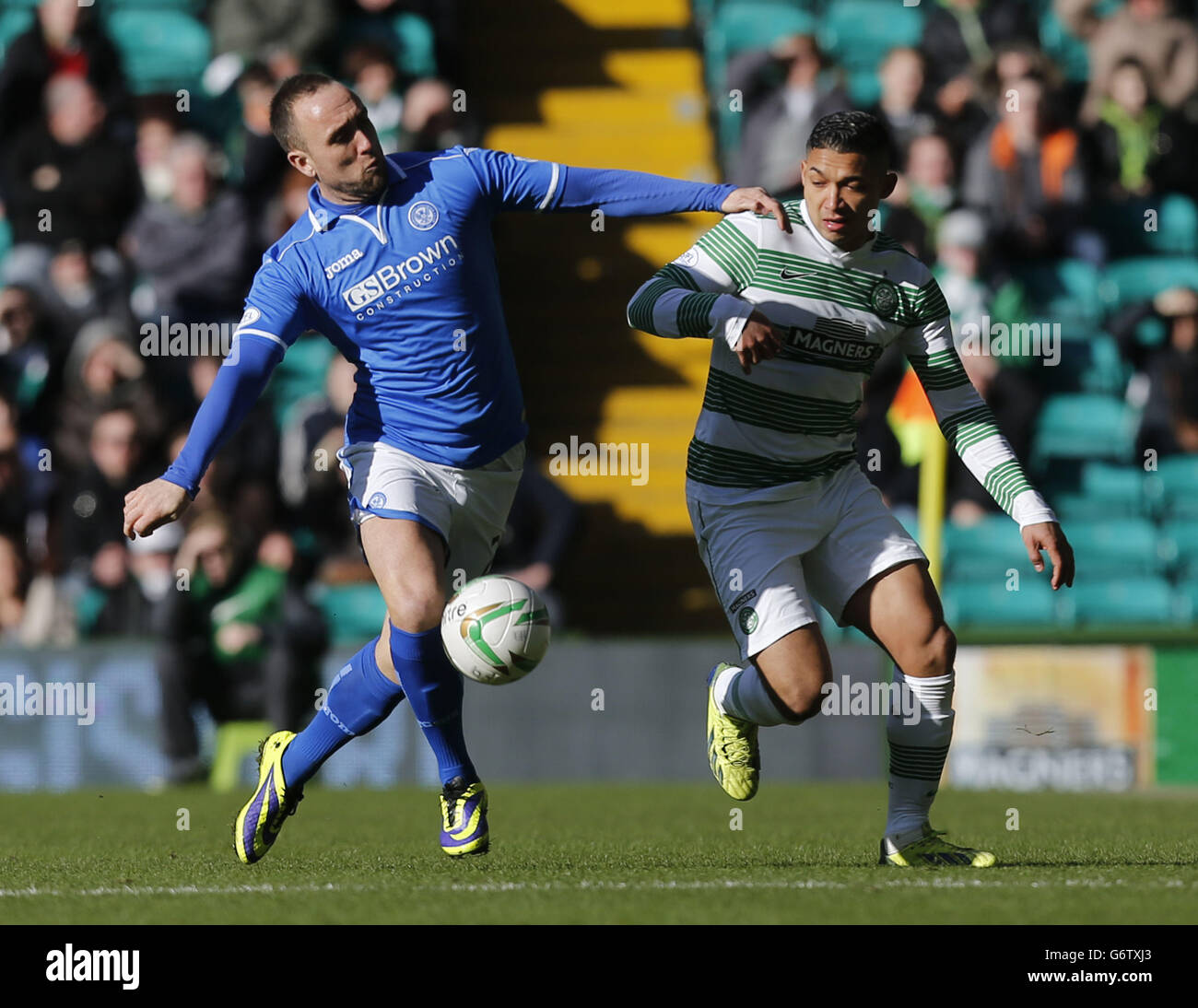 St Johnstone's Lee Croft (left) and Celtic's Emilio Izaguirre battle ...