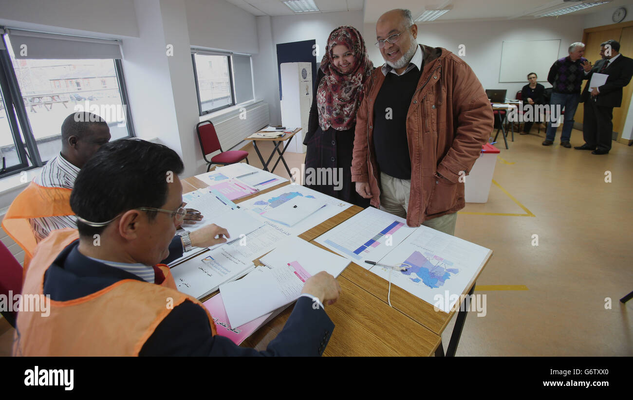 Photo. Tibrah Bazama and her father Ibrahim check their names on the ...