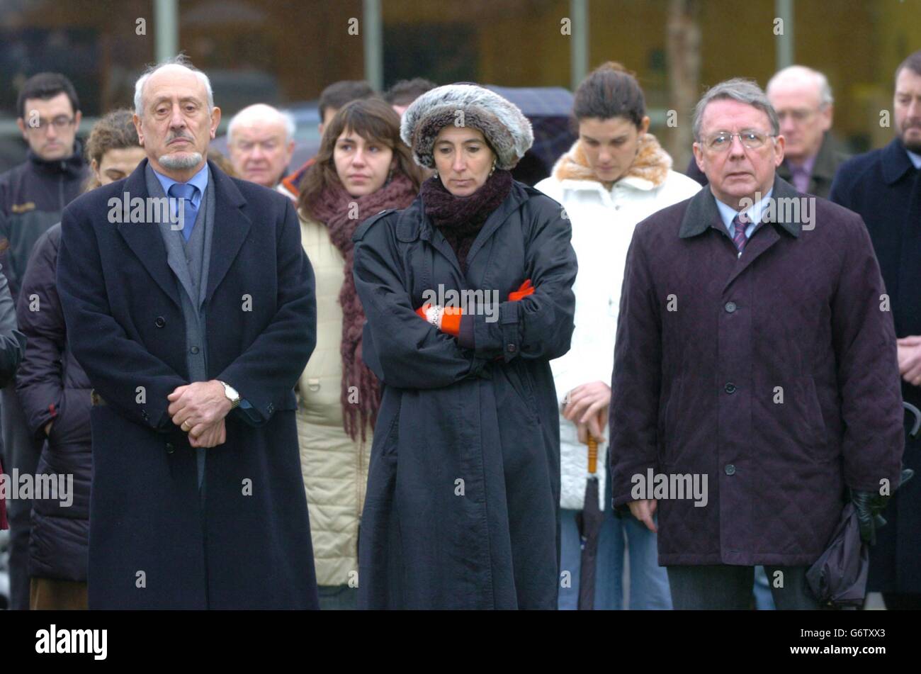 Members of the public observe a minutes silence outside the Spanish ...