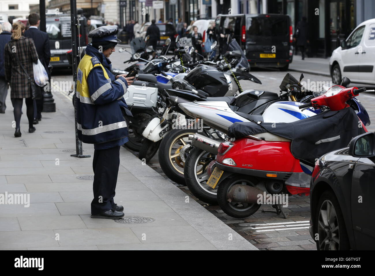 Parking stock. A parking enforcement officer in London Stock Photo - Alamy