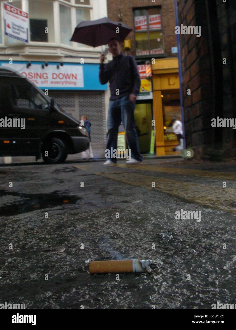 A cigarette on the pavement ban on smoking in the work place Stock ...