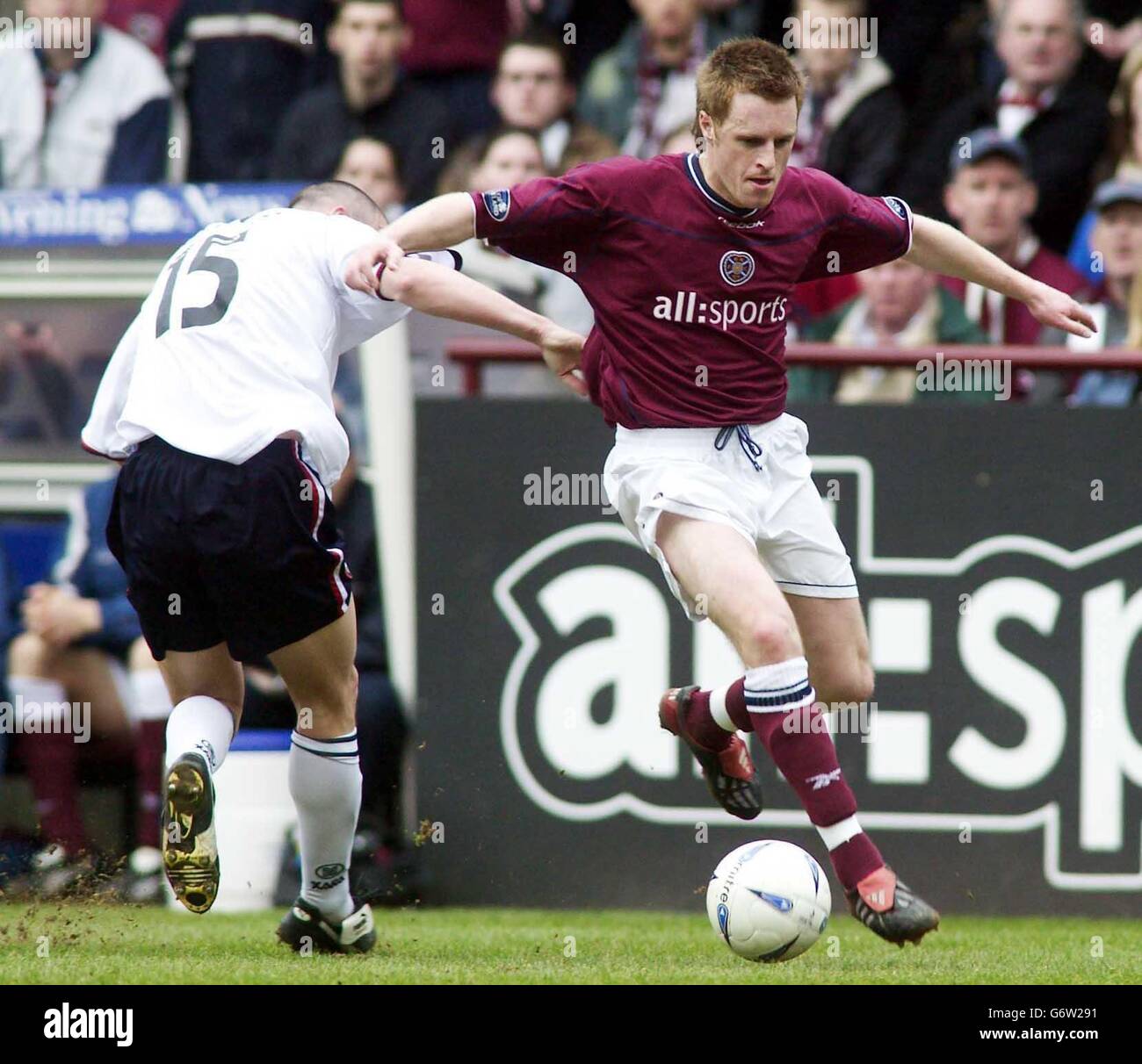 Hearts' Alan Maybury (R) goes past Dundee's Steven Milne during the ...