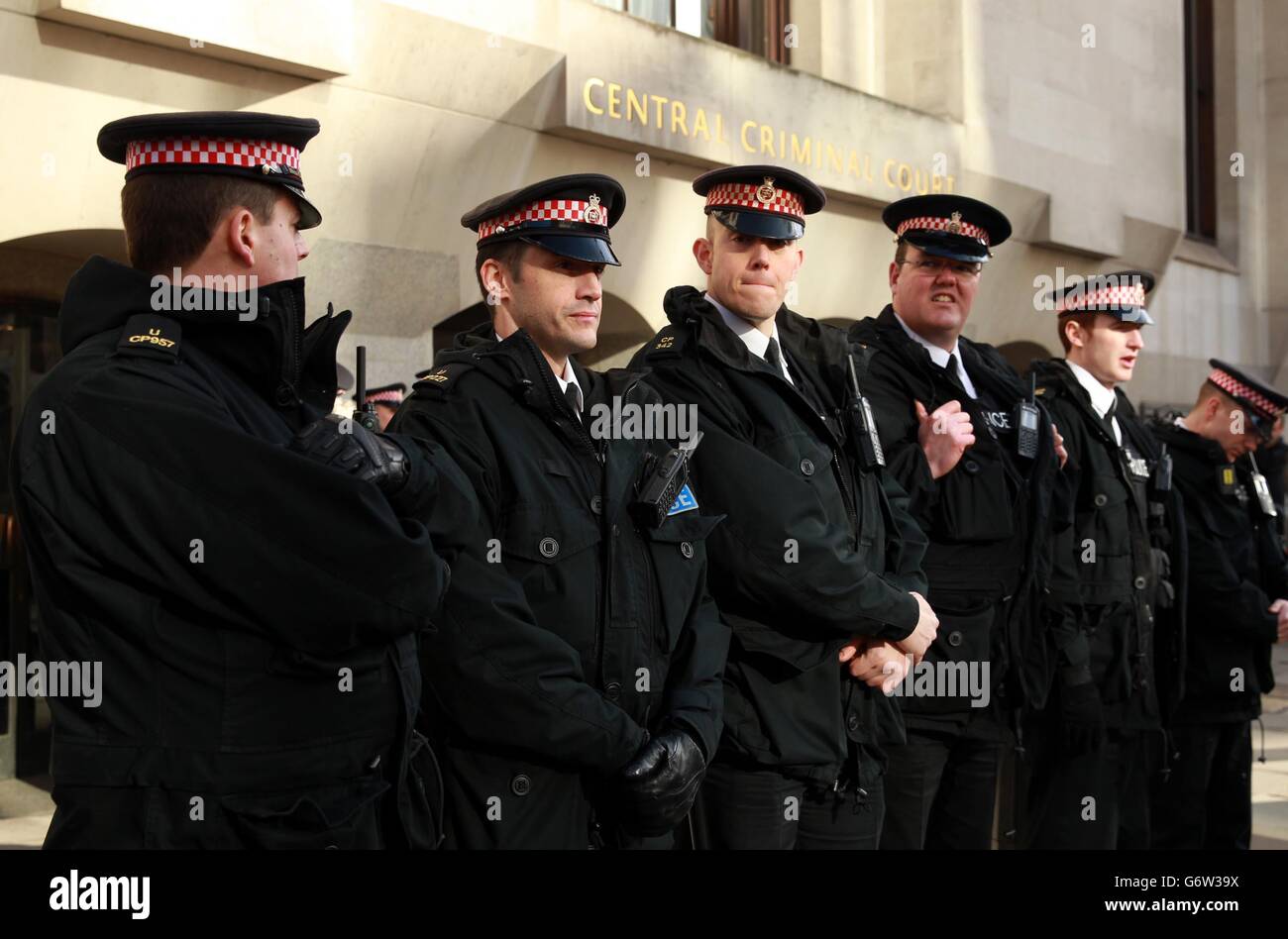 Police outside the Old Bailey in London ahead of the sentencing of ...