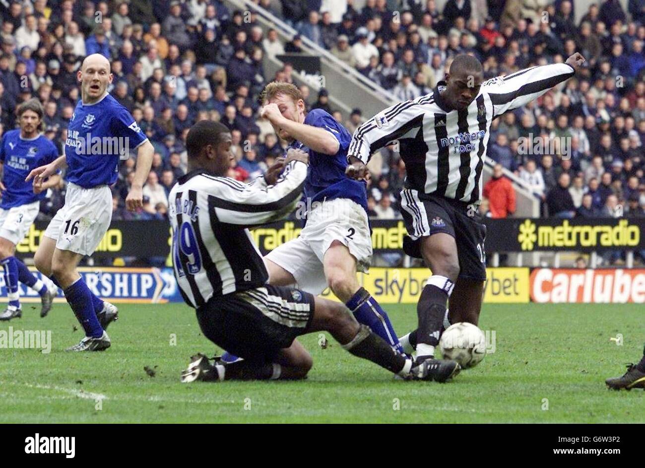 Newcastle's Titus Bramble (L) and Shola Ameobi (R) rob Everton's Steve ...