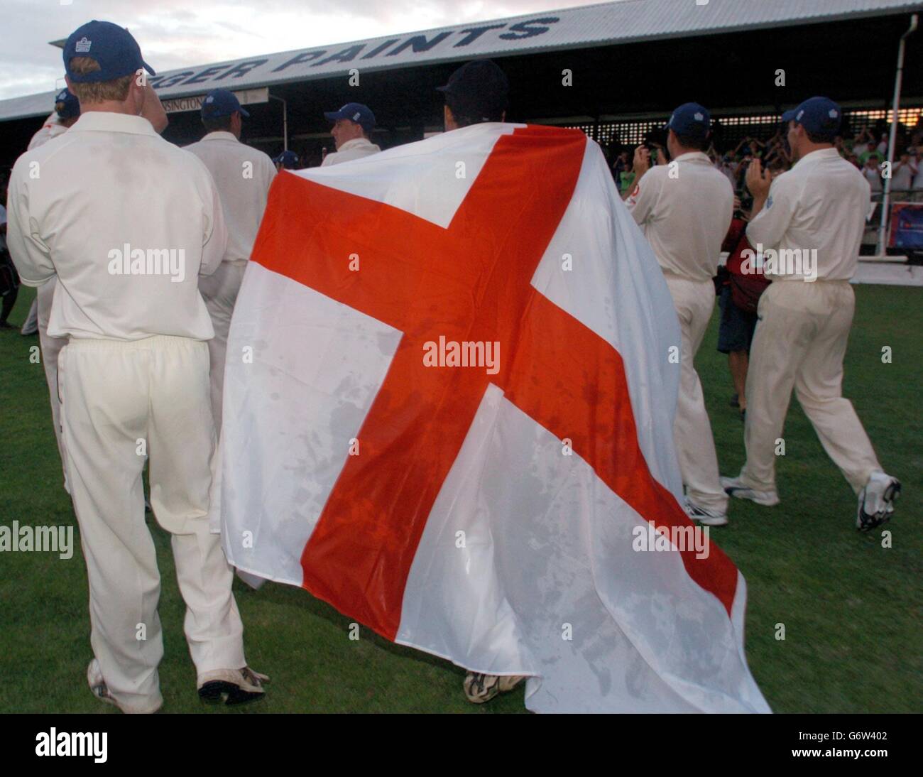 The England cricket team walk around the ground celebrating winning the ...