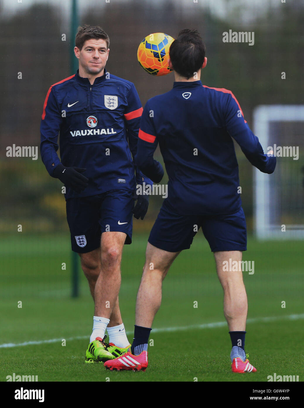 England's captain Steven Gerrard warms up with Leighton Baines during a ...