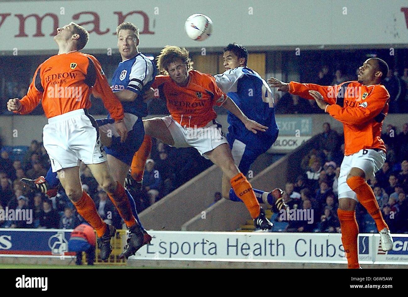 Millwall's Neil Harris (second left) and Tim Cahill find their way to ...