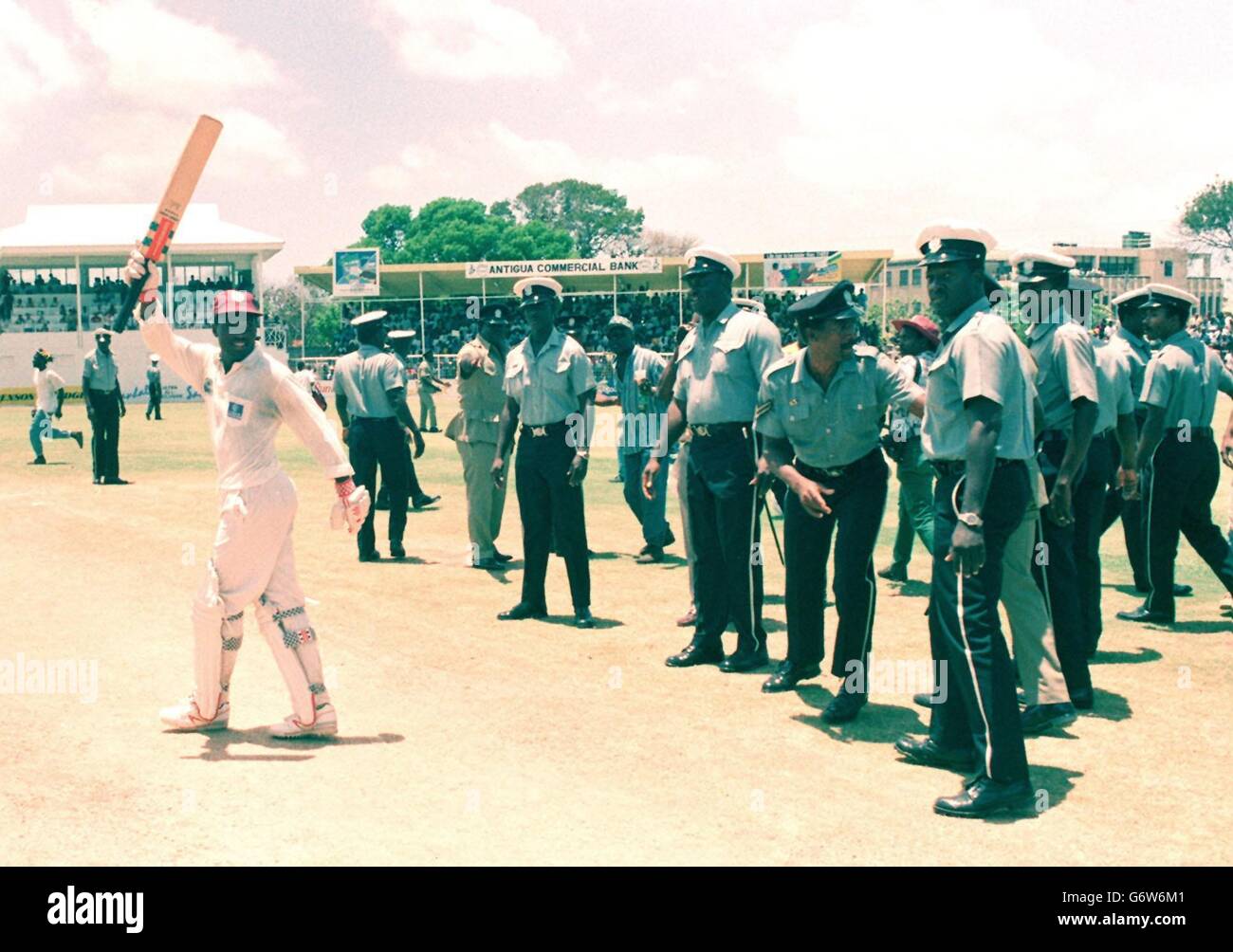 Cricket batsman raising bat hi-res stock photography and images - Alamy