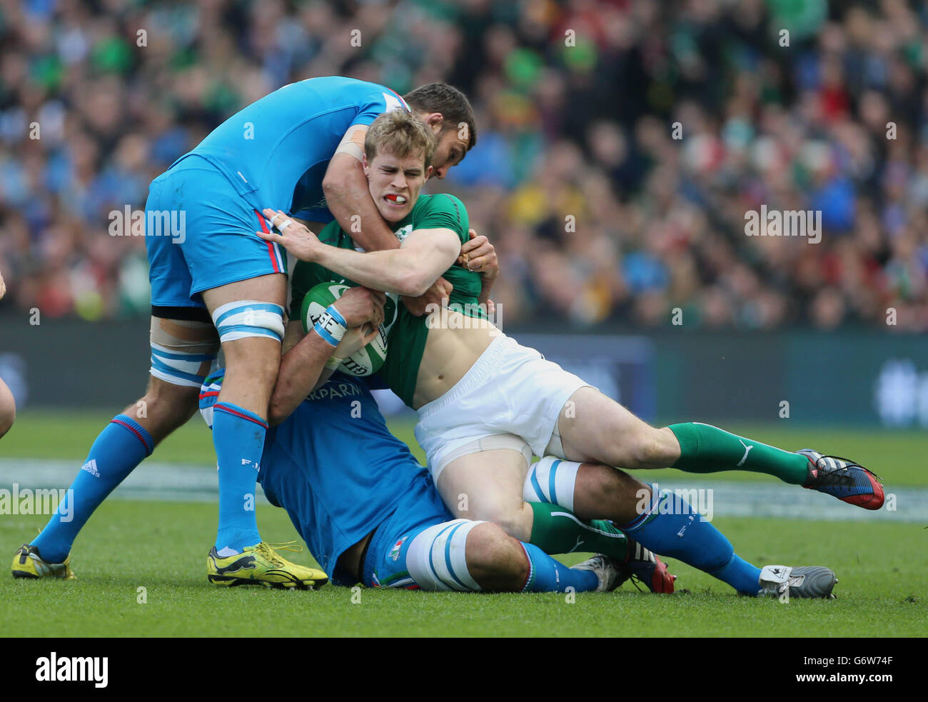 Ireland's Andrew Trimble and Italy's Marco Bortolami (centre) in action ...