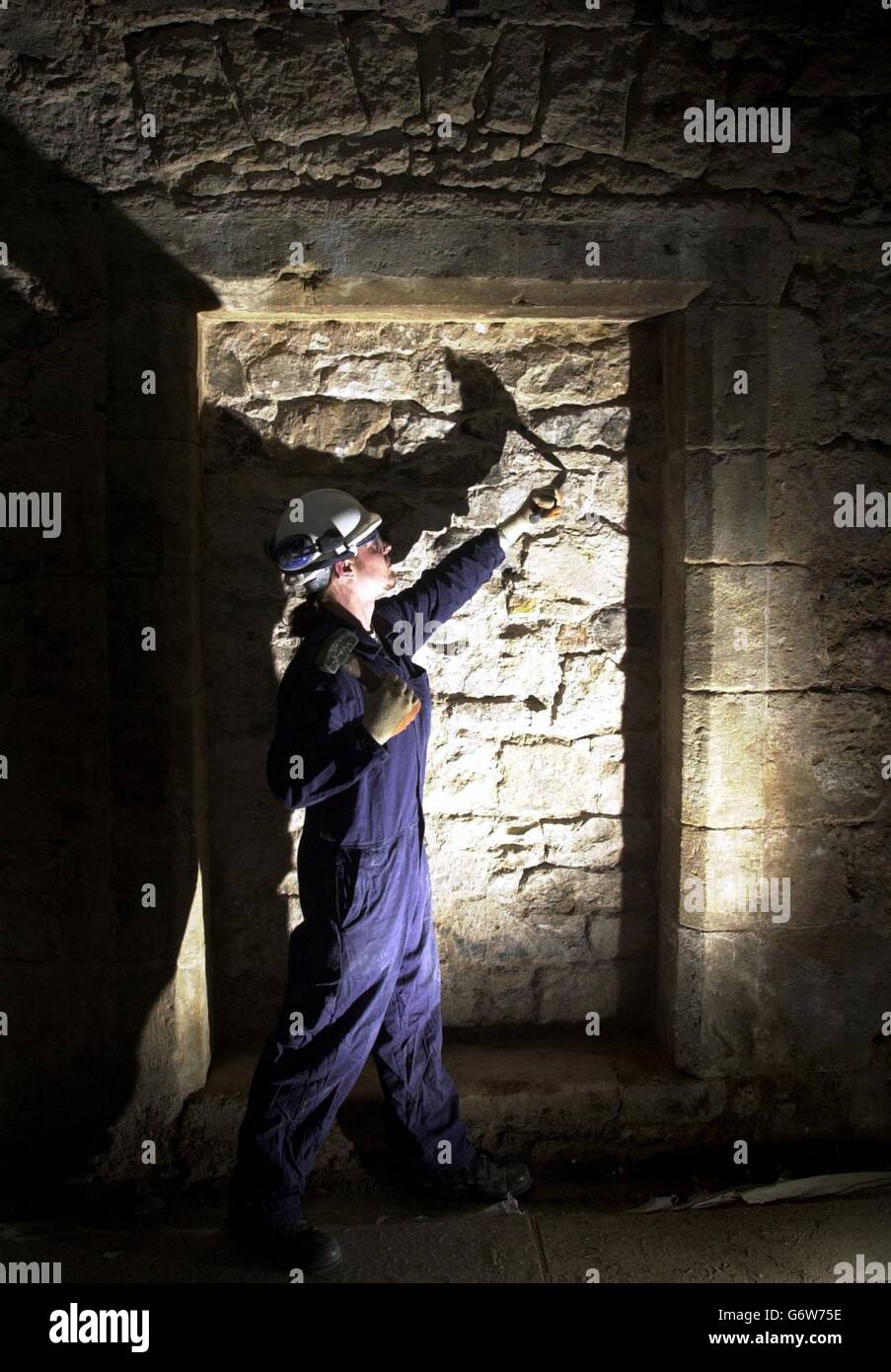 Stonemason Gordon Macgregor finishes uncovering a hidden doorway in the ...