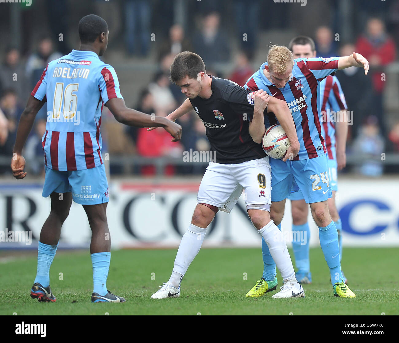 Northampton Town's John Marquis and Scunthorpe United's David Syers ...