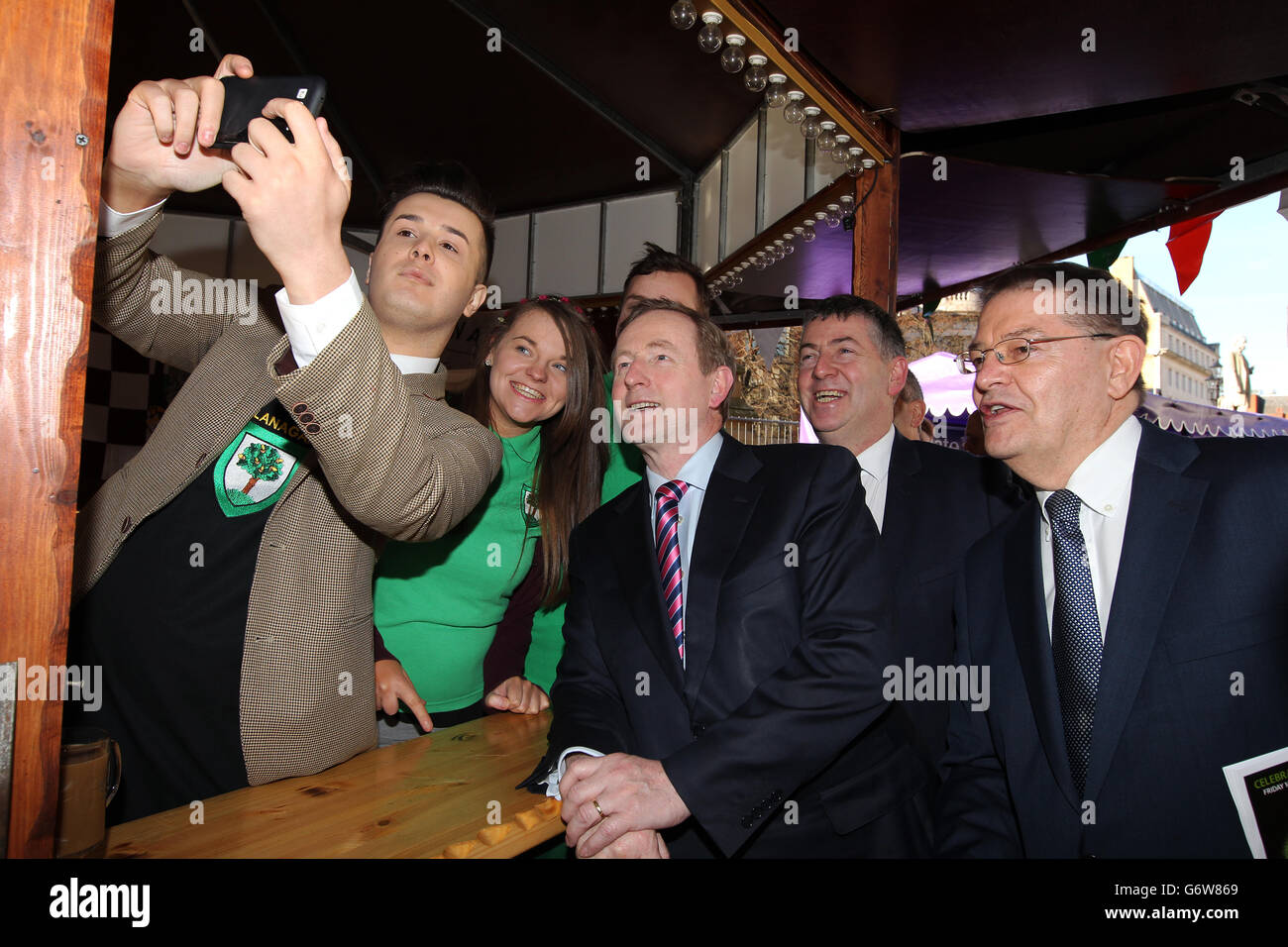 Taoiseach Enda Kenny (centre) has a selfie taken with Fabian Bohan ...