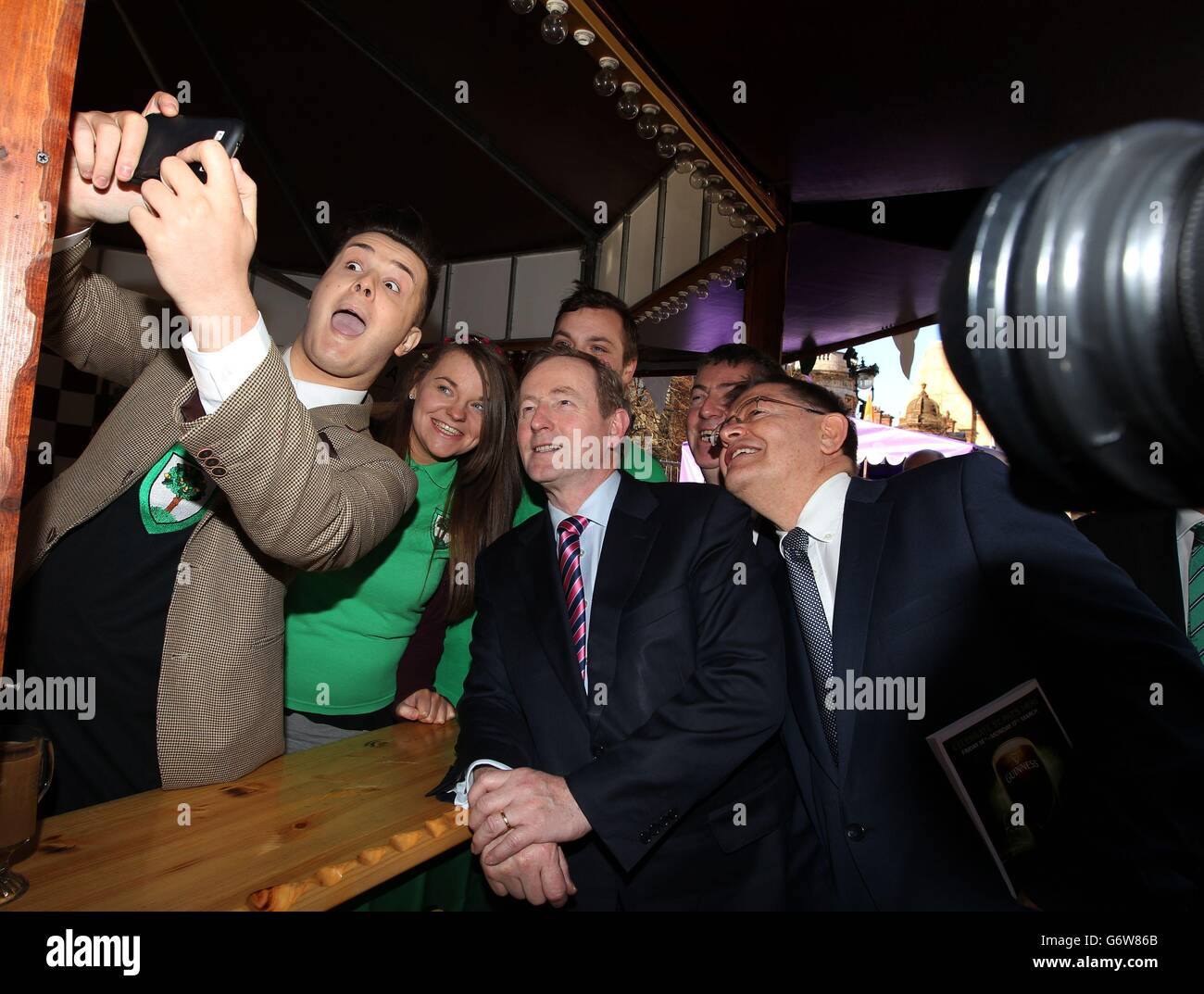 Taoiseach Enda Kenny (centre) has a selfie taken with Fabian Bohan ...
