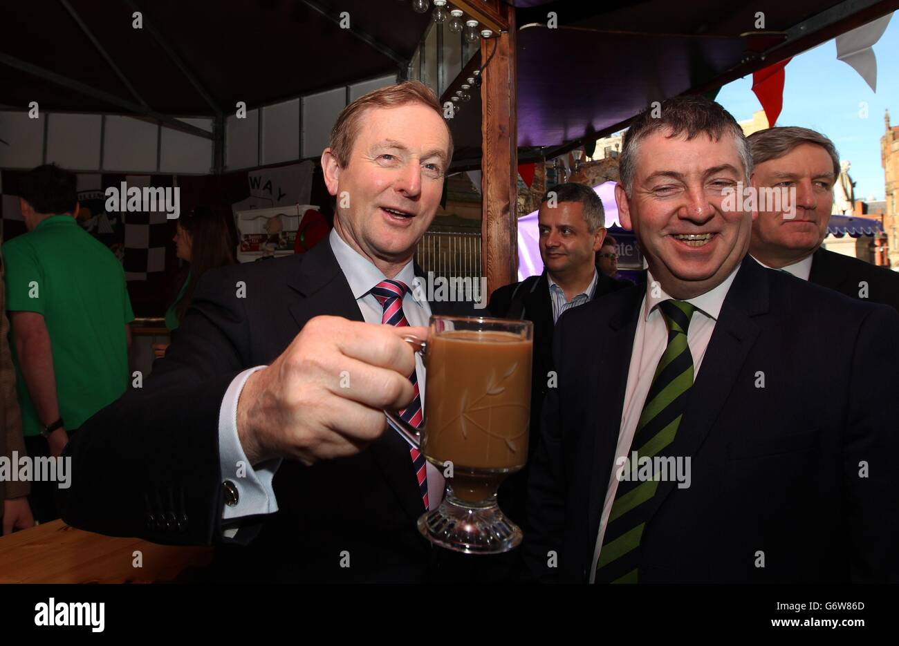 Taoiseach Enda Kenny (left) has an Irish coffee outside the town hall ...