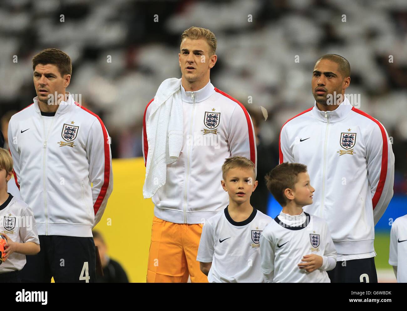 Joe hart and glen johnson during the anthems hi-res stock photography ...