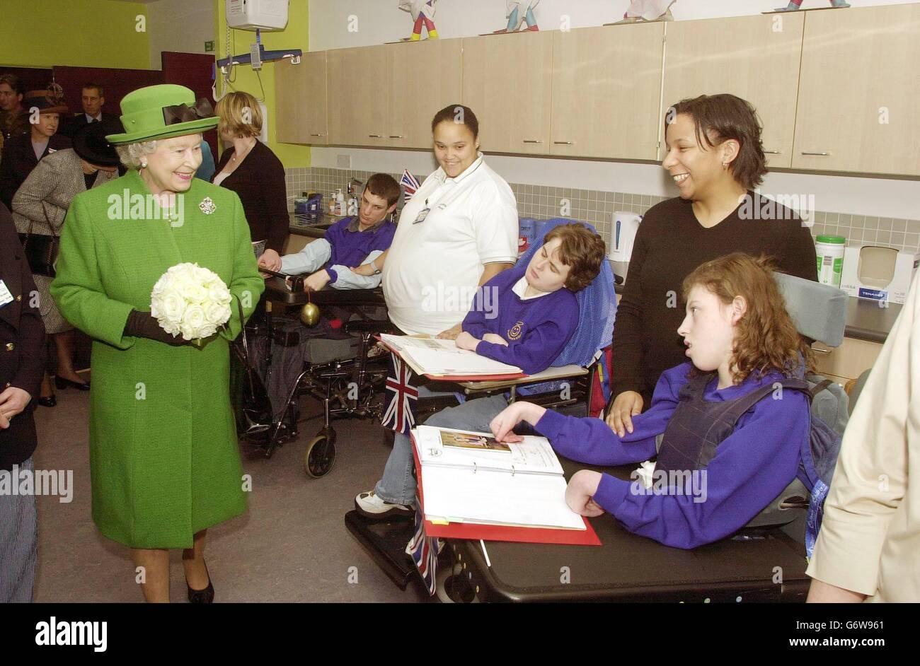 Queen Elizabeth II, tours a classroom at the Children's Trust, Tadworth ...