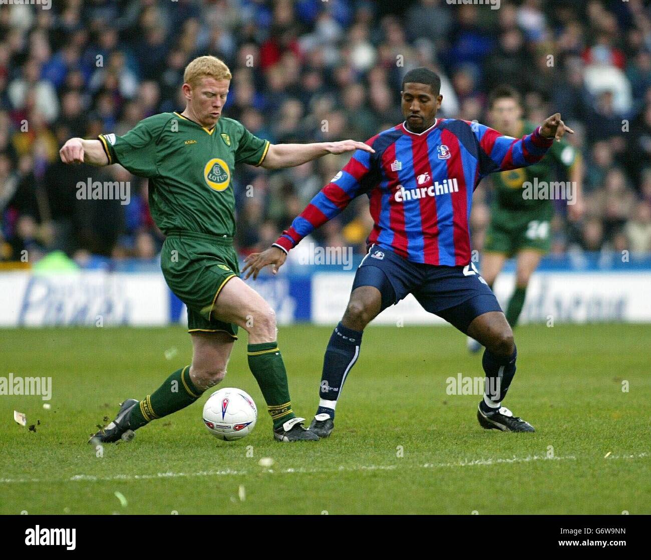 Norwich City's Gary Holt (L) goes past Crystal Palace's Mikele ...