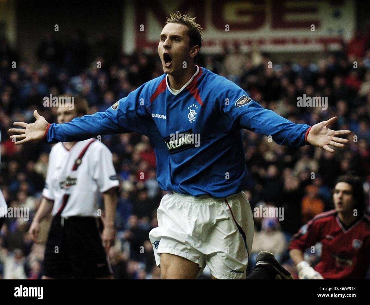 Rangers' Peter Lovenkrands celebrates his goal against Dundee during ...
