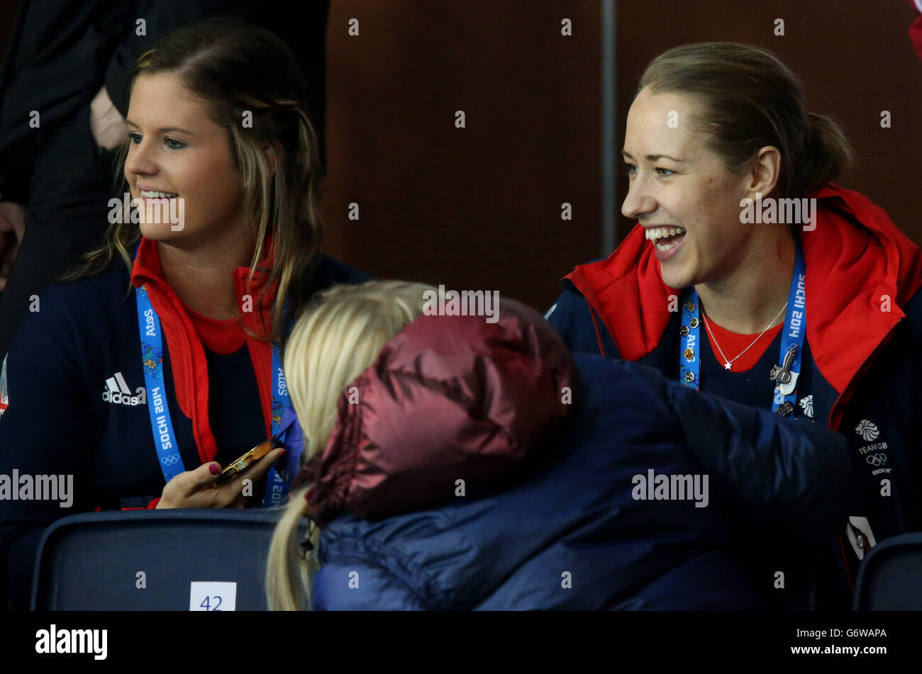 Great Britain's skeleton Gold medalist Lizzie Yarnold (centre) shows ...