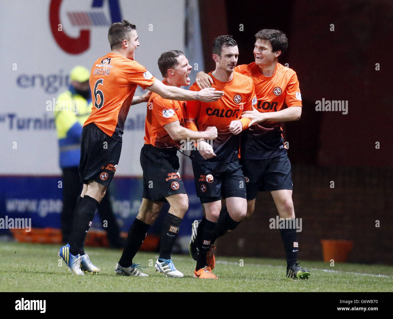 Dundee United's Gavin Gunning (second right) celebrates his goal with ...