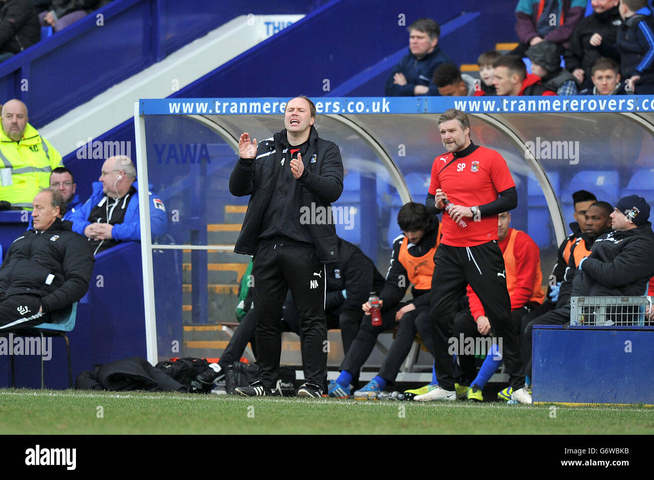 Coventry City assistant manager Neil MacFarlane (centre) encourages the ...