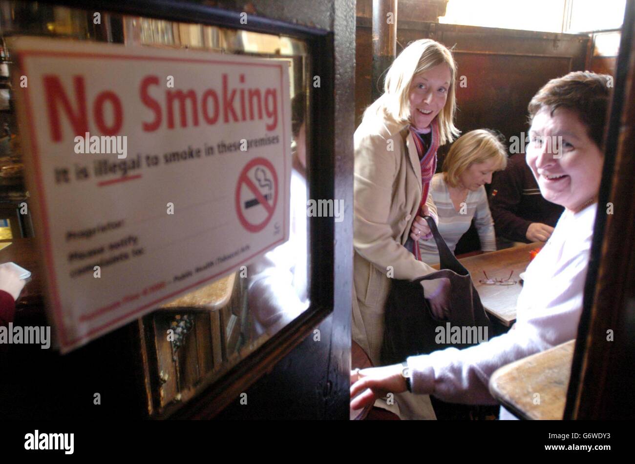 A sign informing customers of the new law against smoking, in Doheny ...