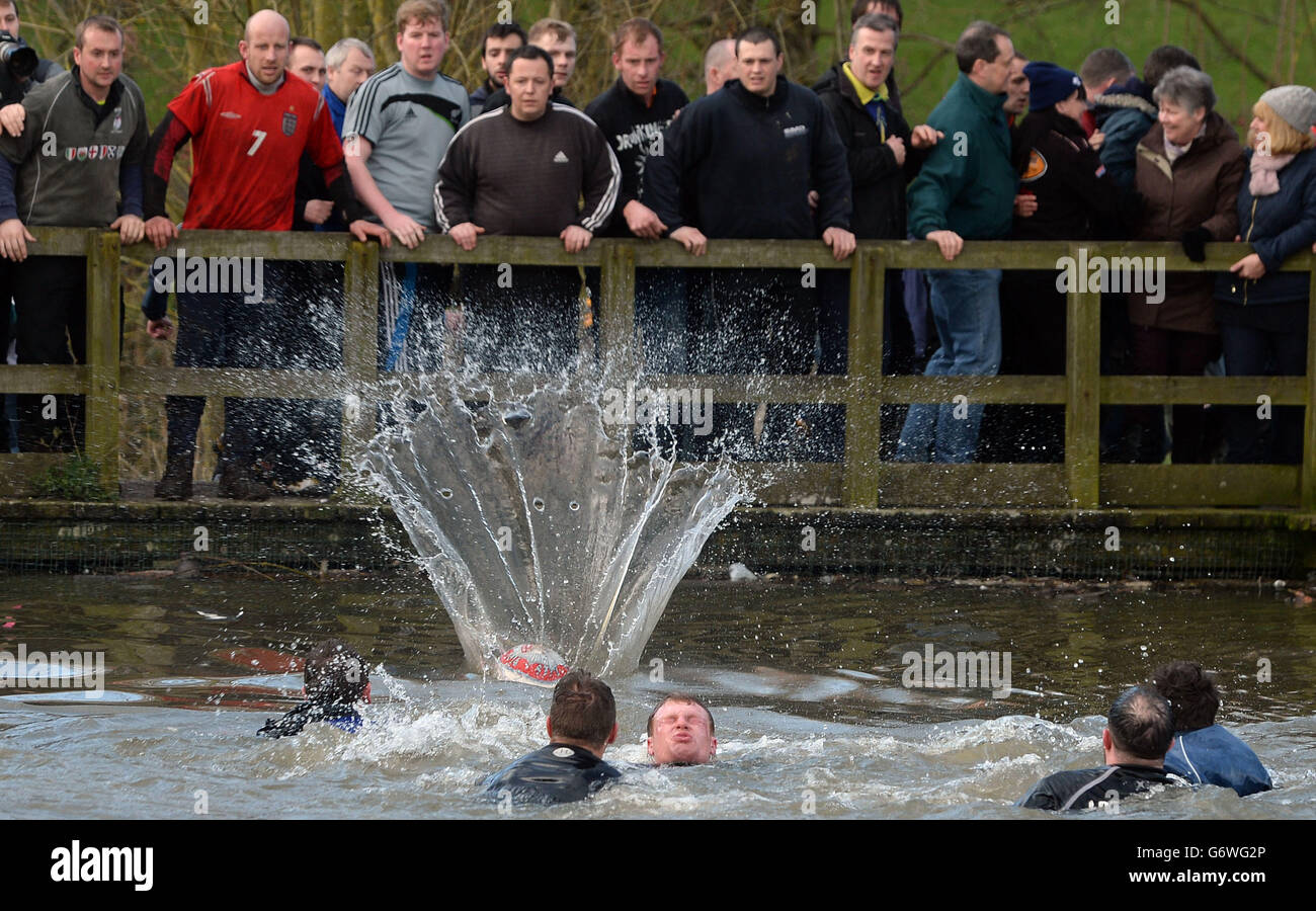 Shrove Tuesday. The ball lands in Ashbourne fishpond as the Royal ...