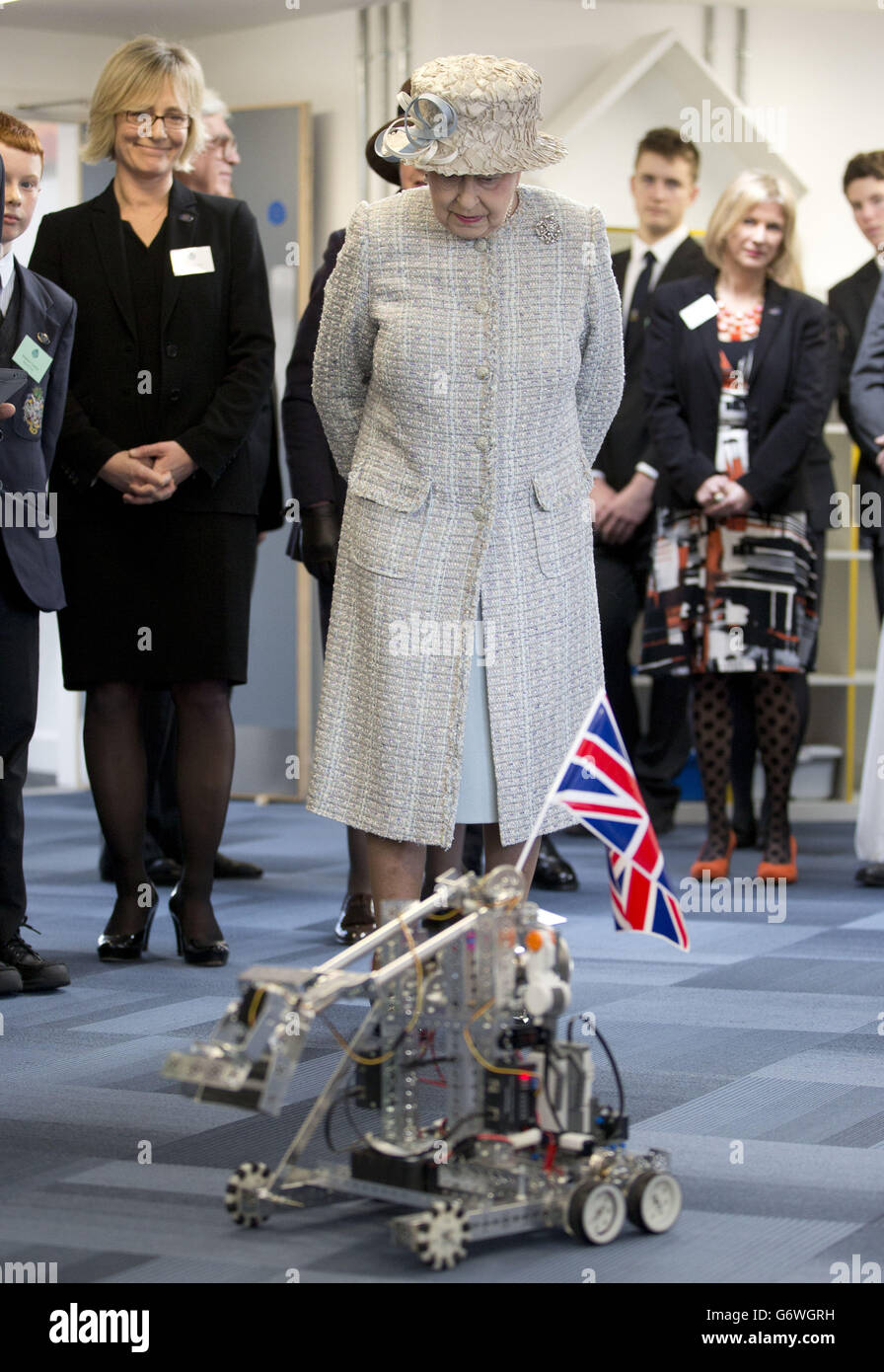 Queen Elizabeth II looks at a robotic demonstration as she visits Reed ...