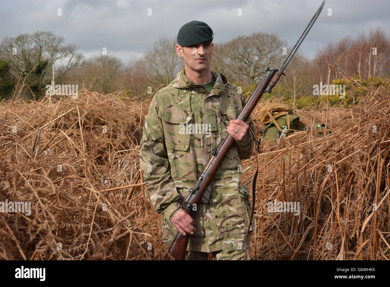 Rifleman Stuart Gray, of the 4th Battalion The Rifles inspects the ...