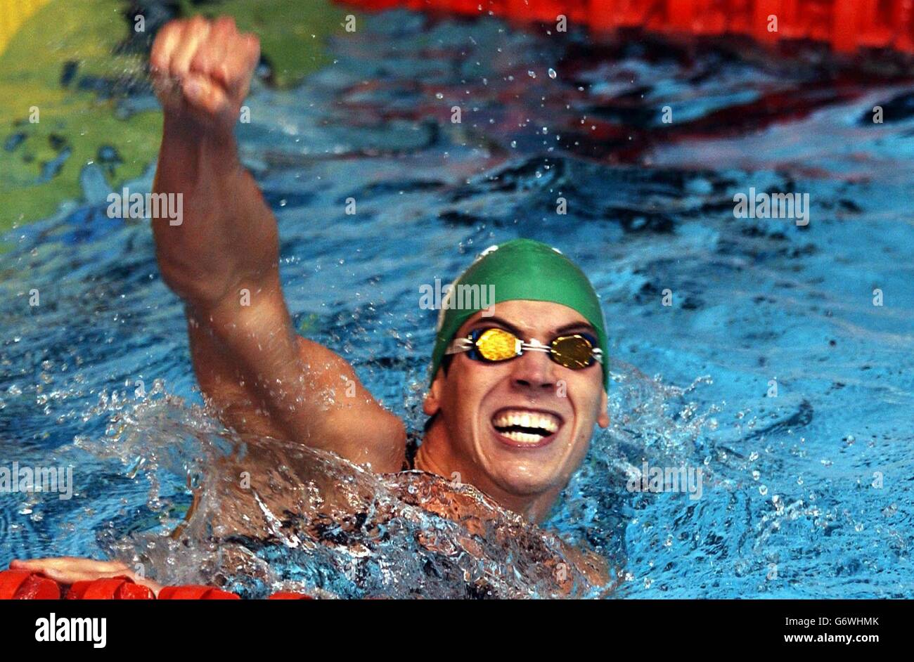 Simon Burnett celebrates winning the Men 200m Freestyle Finals during ...