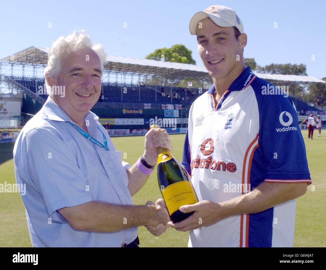 BBC Test Match Special producer Peter Baxter (left) presents a magnum ...
