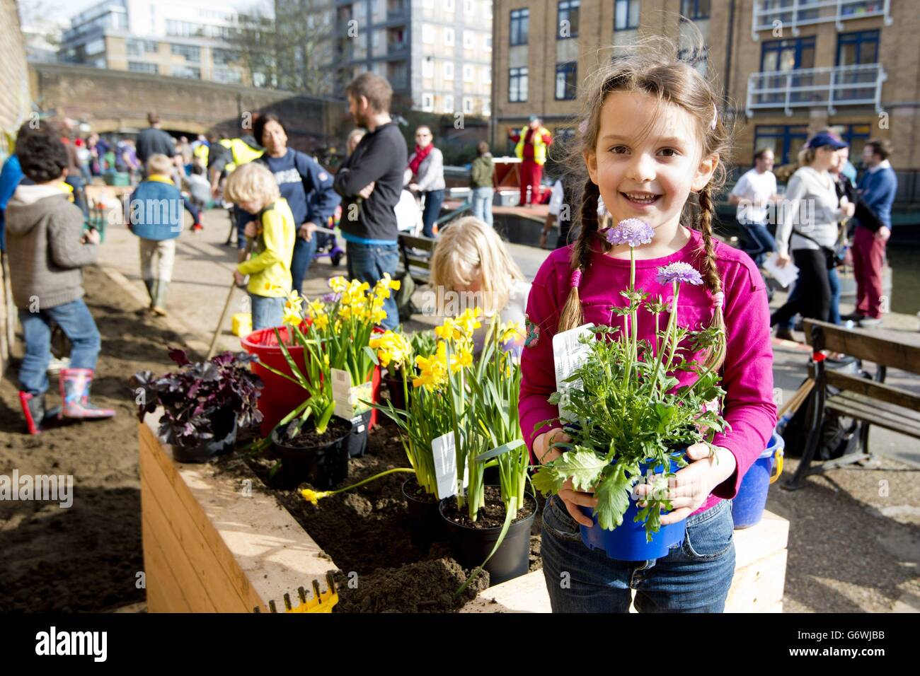 Emily 5, from Hanover Primary School in Islington, London, helps to ...