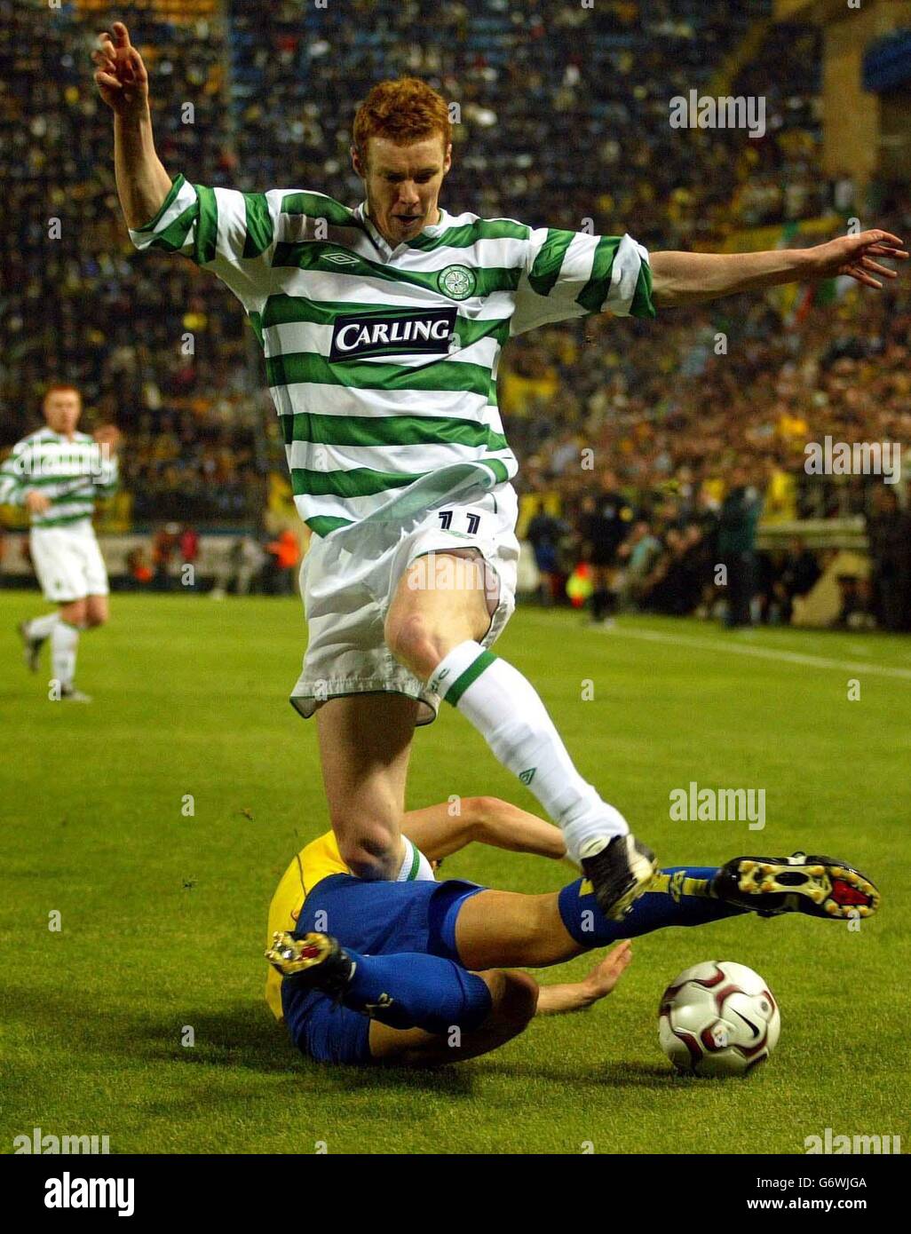 Celtic's Stephen Pearson gets a yellow card for the tackle on ...