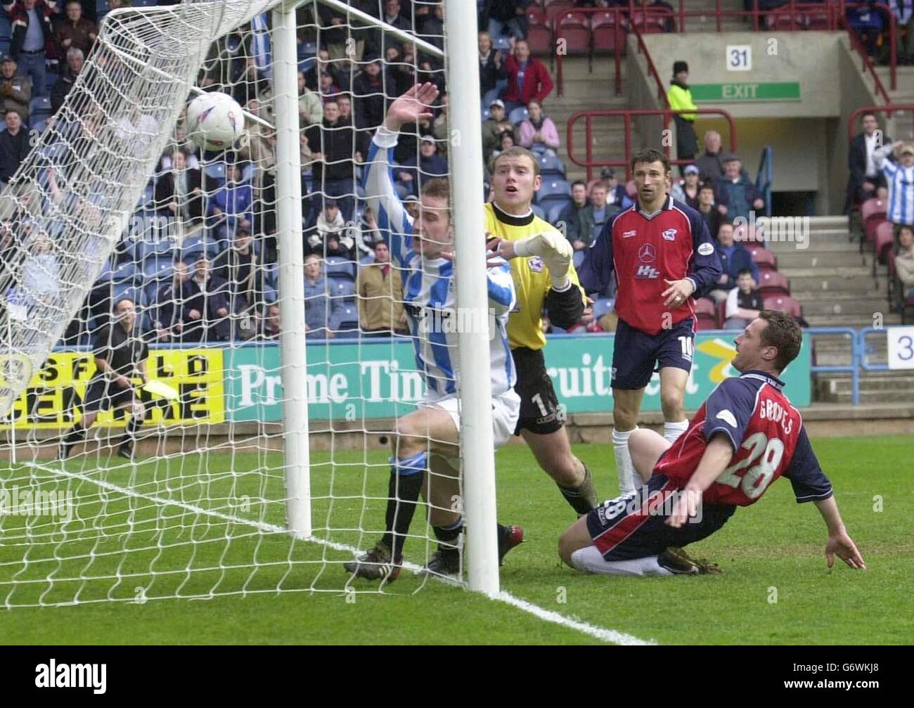 Huddersfield's David Mirfin (left) turns to celebrate his opening goal ...
