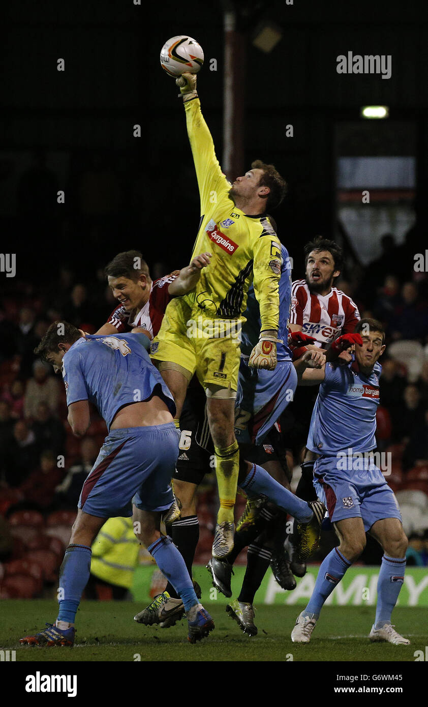 Tranmere Rovers' Owain Fon Williams (centre) makes a punch save during ...